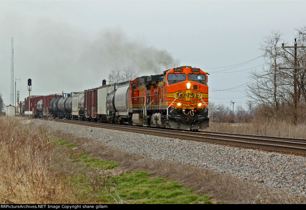 BNSF 5394 Leads a freight into the siding.